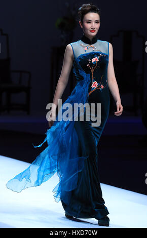 Beijing, China. 28th Mar, 2017. Models present creations designed by ...