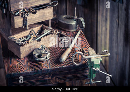 Aged locksmiths workshop with ancient tools Stock Photo - Alamy