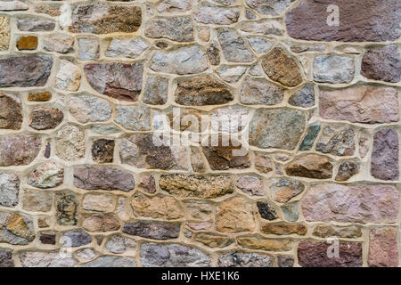 Rock wall and field Stock Photo - Alamy
