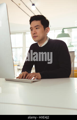 Male business executive using laptop Stock Photo - Alamy