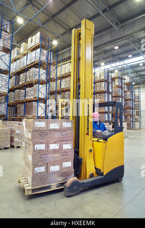 High rack stacker forklift truck in warehouse rows Stock Photo - Alamy
