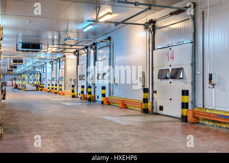 Industrial loading dock area inside cold storage warehouse ...