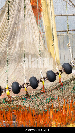 Boom with fishing nets on commercial fishing boat trawler in harbour ...