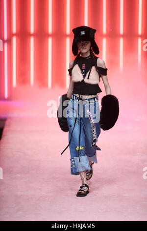 Beijing, China. 28th Mar, 2017. Models present creations designed by ...