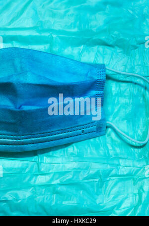 Protective medical mask on a blue background. Virus and flu protection ...