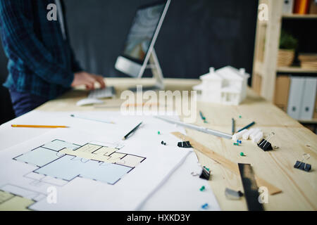 Interior architect designer at workstation table designing house ...