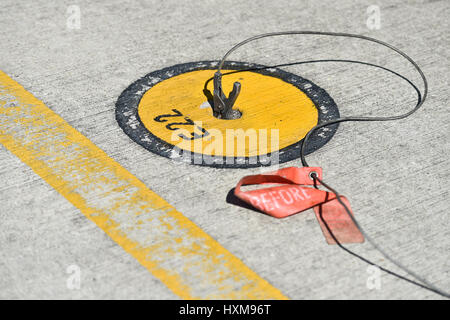 Static grounding clamps connected on an airplane on the runway Stock ...