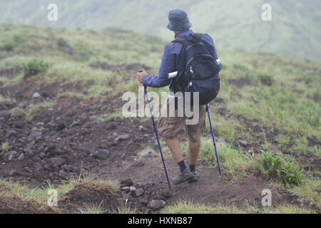 Person on a difficult and exhausting Hike to very high mountain Stock ...