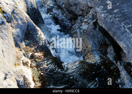 Water streaming down rocks Stock Photo - Alamy