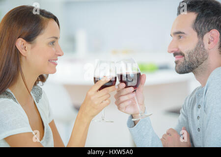 happy young couple having lanch at beautiful restaurant on by the sea ...