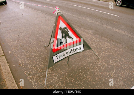 Tree cutting safety sign and cone on the street warning about of Stock ...