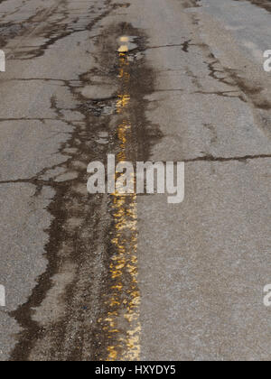 Road with asphalt in very poor condition, damaged, full of potholes, in ...