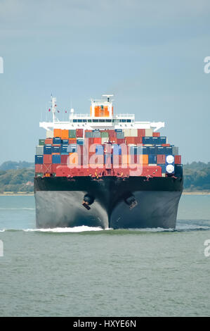 Huge fully loaded container ships are discharged with gantry cranes ...