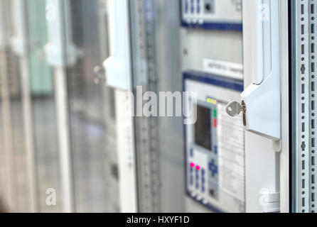 Front glass doors on electrical control cubicles and key in control ...