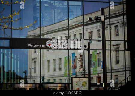Barnsley Sixth Form College reflects the Town hall in its window ...