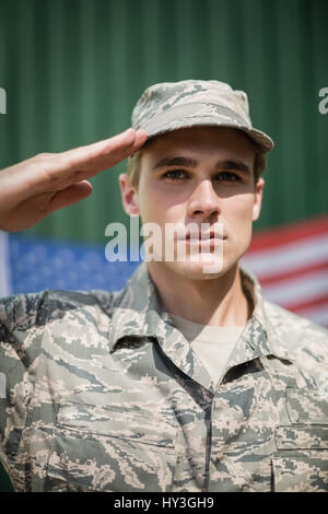 Portrait of military soldier giving salute in boot camp Stock Photo - Alamy