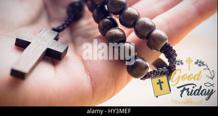 Easter message against hand holding rosary beads Stock Photo - Alamy