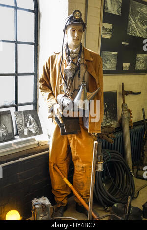Miners' outfit with mask and helmet, safety suit on display at Coal ...
