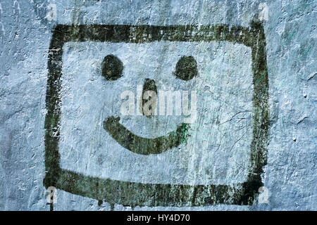 Funny faces drawn on a surface Stock Photo - Alamy