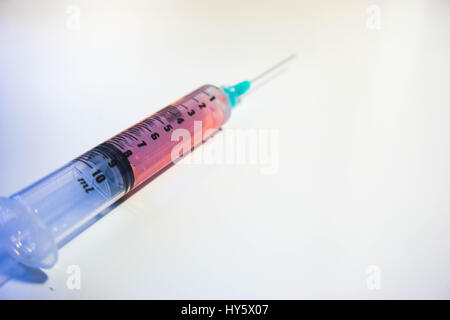 A low-angle shot of a plastic syringe for kids Stock Photo - Alamy
