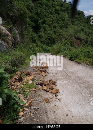 rural roads, rocks and green grass under sunshine Stock Photo - Alamy