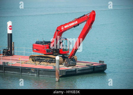 ML Dredging, digger and platform in Portsmouth Harbour Stock Photo - Alamy