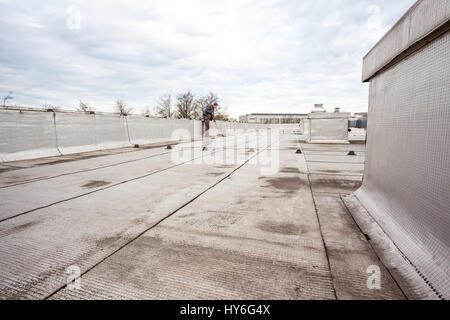 an flat roof with roofing and fencing Stock Photo - Alamy