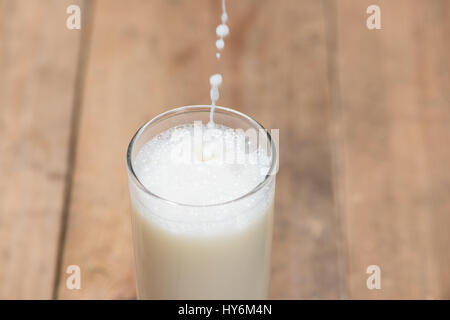 Milk. Image of Milk fall into glass Stock Photo - Alamy