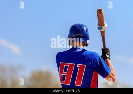 baseball player holding bat back to standing Stock Photo - Alamy