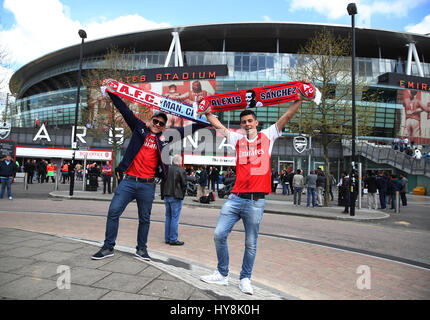Fans pose for a picture outside the Arsenal Armoury shop at the ...