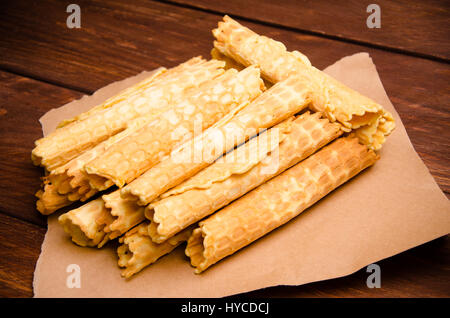 tubular wafer. waffles on Kraft paper. waffles on wooden boards Stock ...