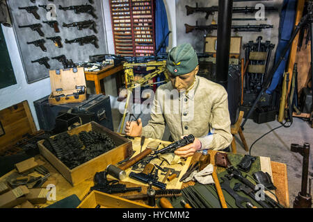 Diorama showing German WWII gunsmith repairing guns at arsenal ...