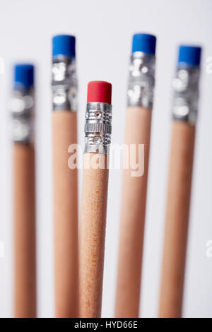 Vertical shot of red and blue pencils on a pink surface Stock Photo - Alamy
