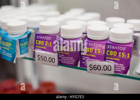 various bottles of Stratos brand recreational TCH tablets on the shelf ...