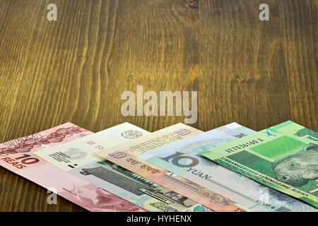 banknotes of the BRICS states on wooden background Stock Photo - Alamy