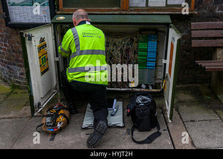 Telephone engineer working at street junction box Stock Photo - Alamy