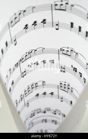 Rolled sheet with music notes, closeup view Stock Photo - Alamy