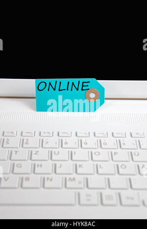 online written on paper tag on a keyboard Stock Photo - Alamy