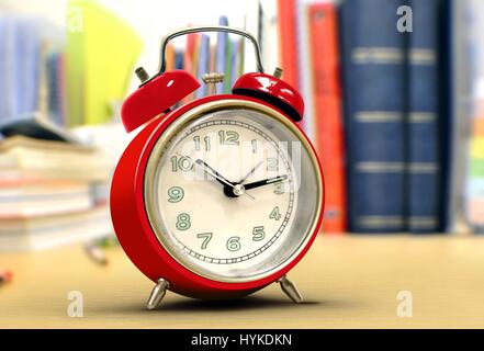 Red alarm clock on wood table with blur nature background and copy ...