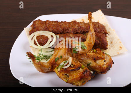 Beef kebab and grilled Quail with onion and parsley Stock Photo - Alamy