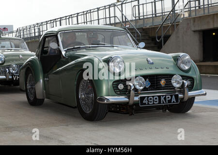 A Green, 1959 Triumph TR3 Sports Car, in the International Pit lane ...
