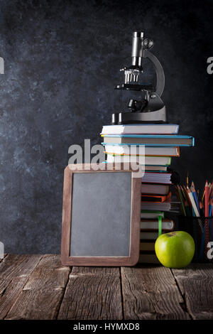 black chalk drawing frame and stack of books, gray background , back to ...