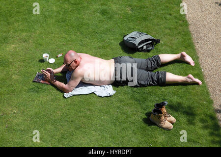 Overweight man sunbathing Stock Photo - Alamy