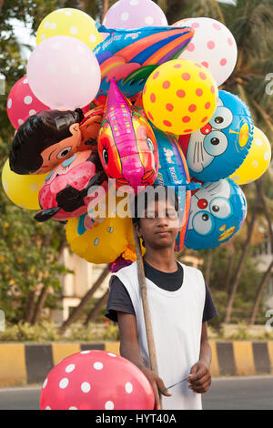 Indian boy selling balloons on Carter Road Promenade, Mumbai, India ...