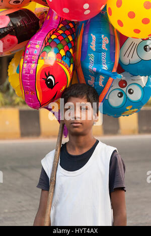 Indian boy selling balloons on Carter Road Promenade, Mumbai, India ...