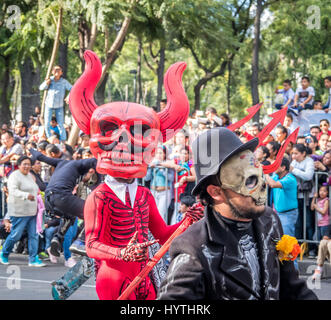 Day of the dead in Mexico. Decoration process of skulls for Day of the ...