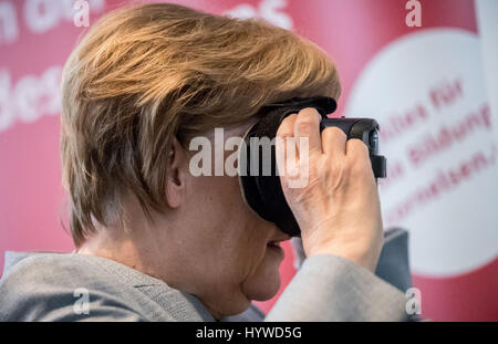 Chancellor Angela Merkel (CDU) puts her hands on her face in the Stock ...