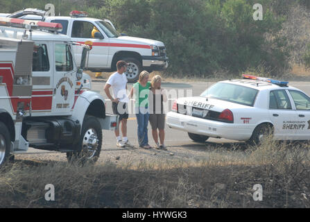 June 25, 2008 - Ron Presba's daughters react to the scene of his burned ...