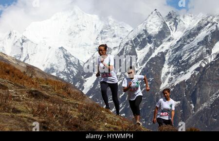 Rasuwa, Nepal. 25th Apr, 2017. Trekkers walk on a route above the area ...