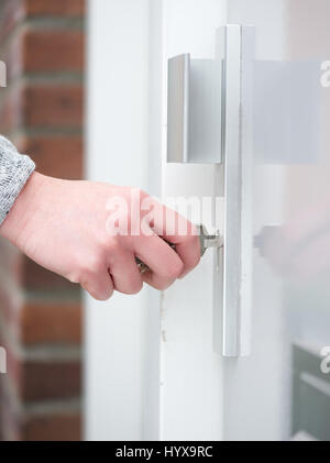 Close-up hand inserting key in antique furniture Stock Photo - Alamy